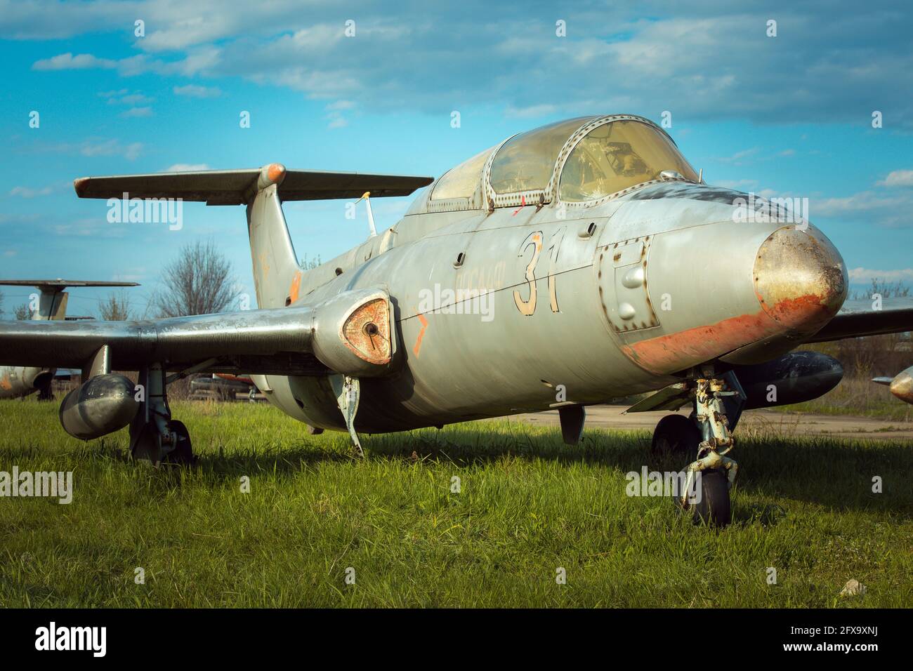 Old Soviet military aircraft standing at the airfield. Rusty used ...