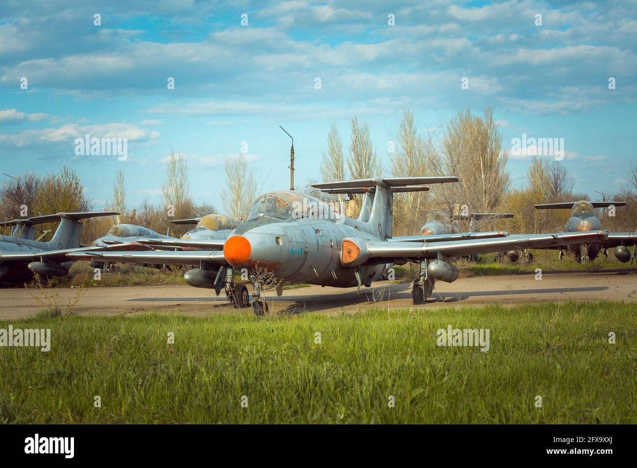 Old Soviet military aircraft standing at the airfield. Rusty used ...