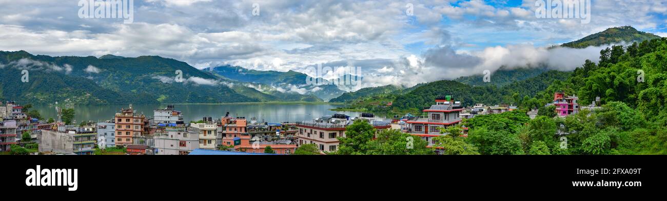 Panoramic view of Fewa Lake surrounded by mountains and the town of ...