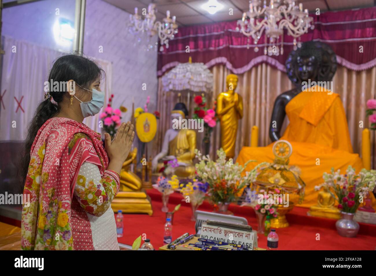 Dhaka, Bangladesh. 26th May, 2021. A Buddhist devotee seen praying in ...