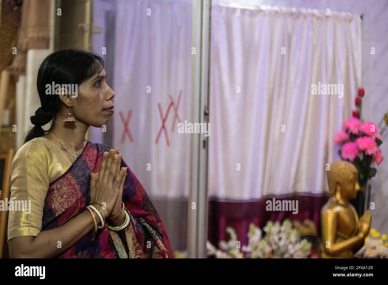Dhaka, Bangladesh. 26th May, 2021. A Buddhist devotee seen praying in ...