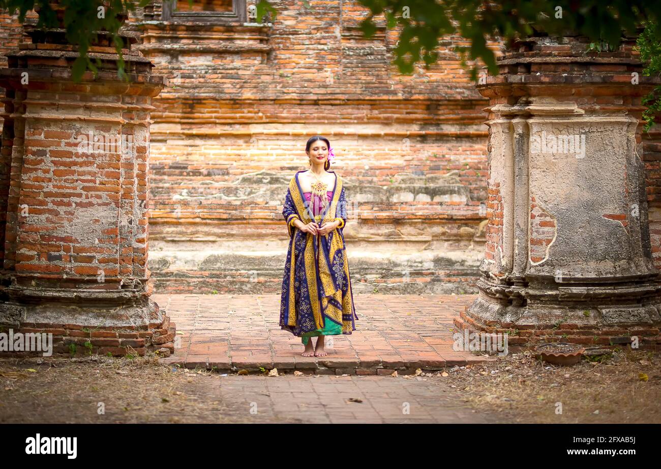 Asian travel background. Beautiful Balinese dancer woman in traditional ...