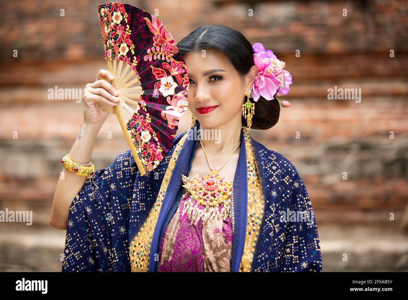 Asian travel background. Beautiful Balinese dancer woman in traditional ...