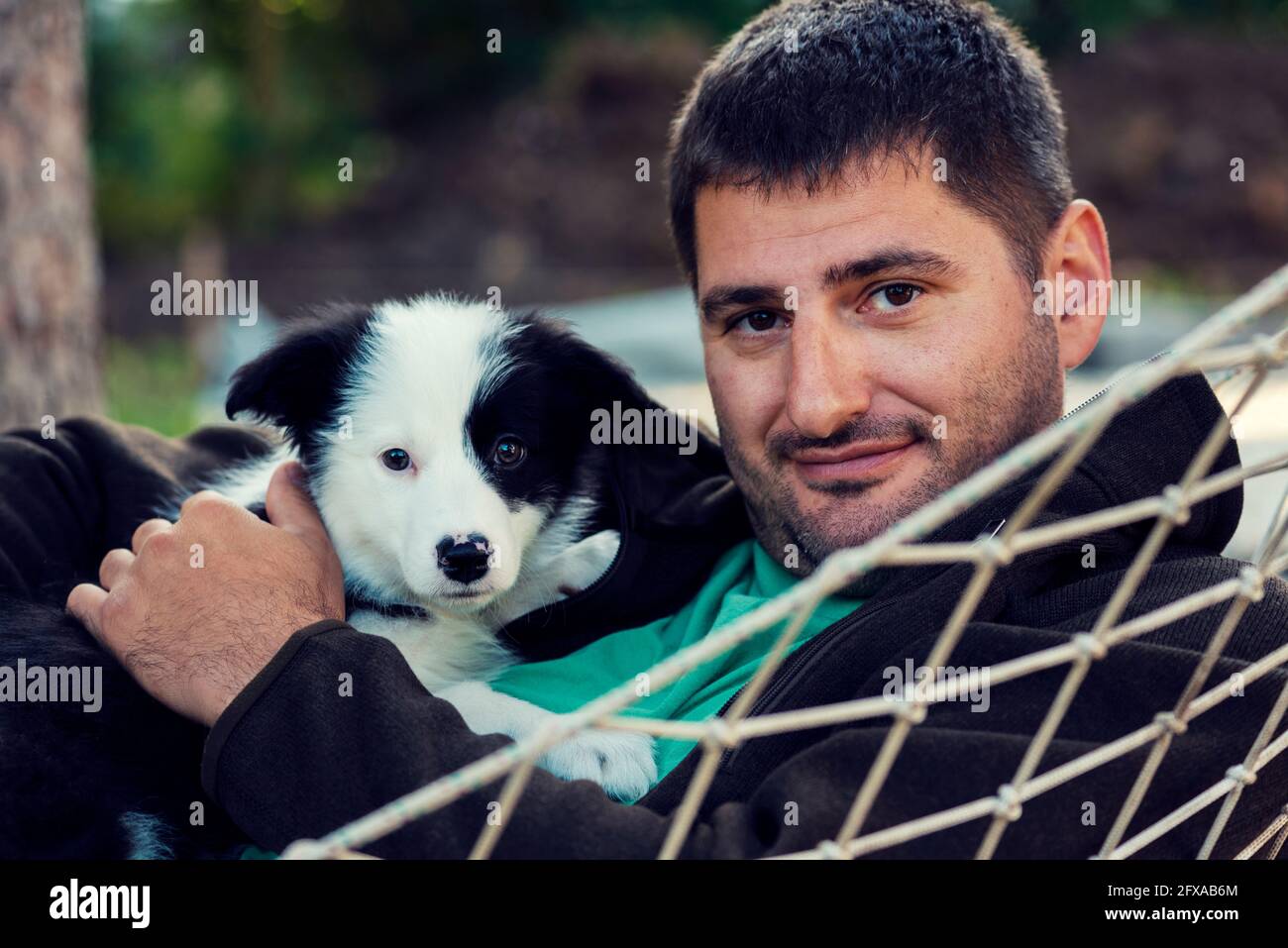 Man cuddle border collie hi-res stock photography and images - Alamy