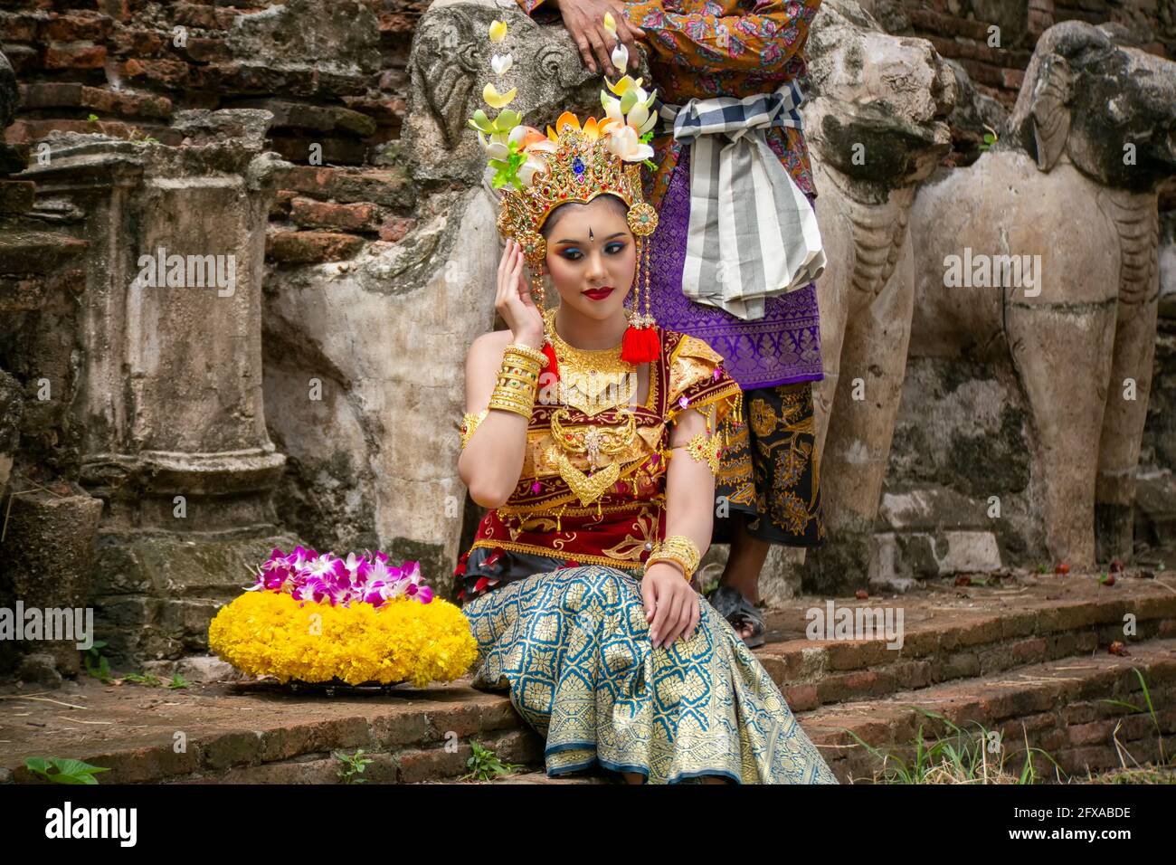 Asian travel background. Beautiful Balinese dancer woman in traditional ...