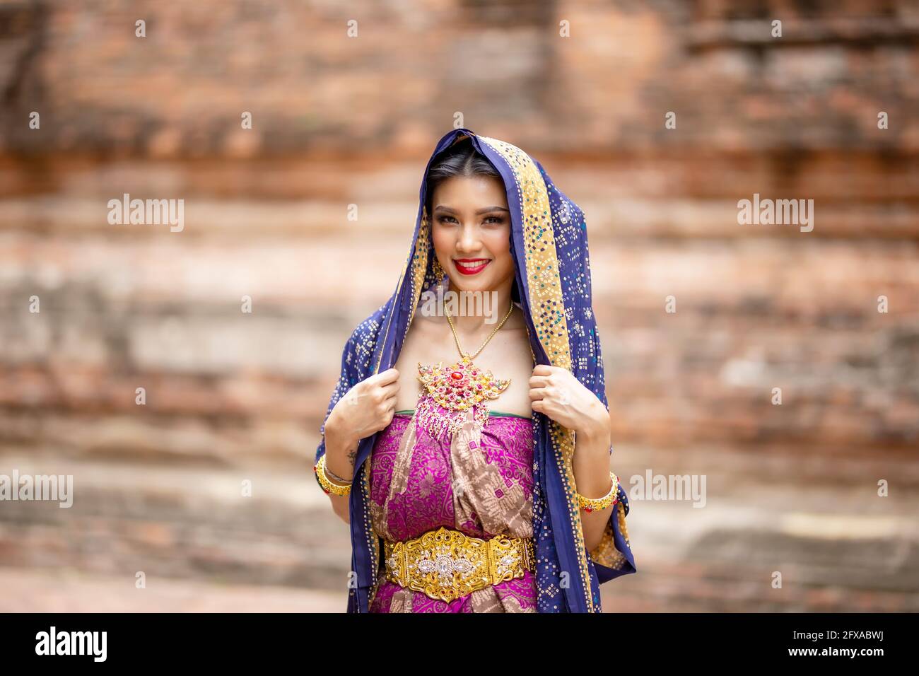 Asian travel background. Beautiful Balinese dancer woman in traditional ...