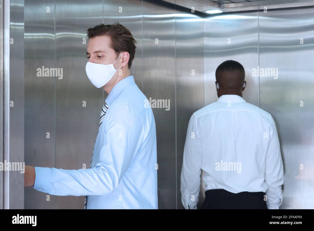 Social distancing in elevators coronavirus outbreak people stay in ...
