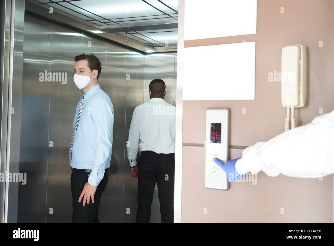 Social distancing in elevators coronavirus outbreak people stay in ...