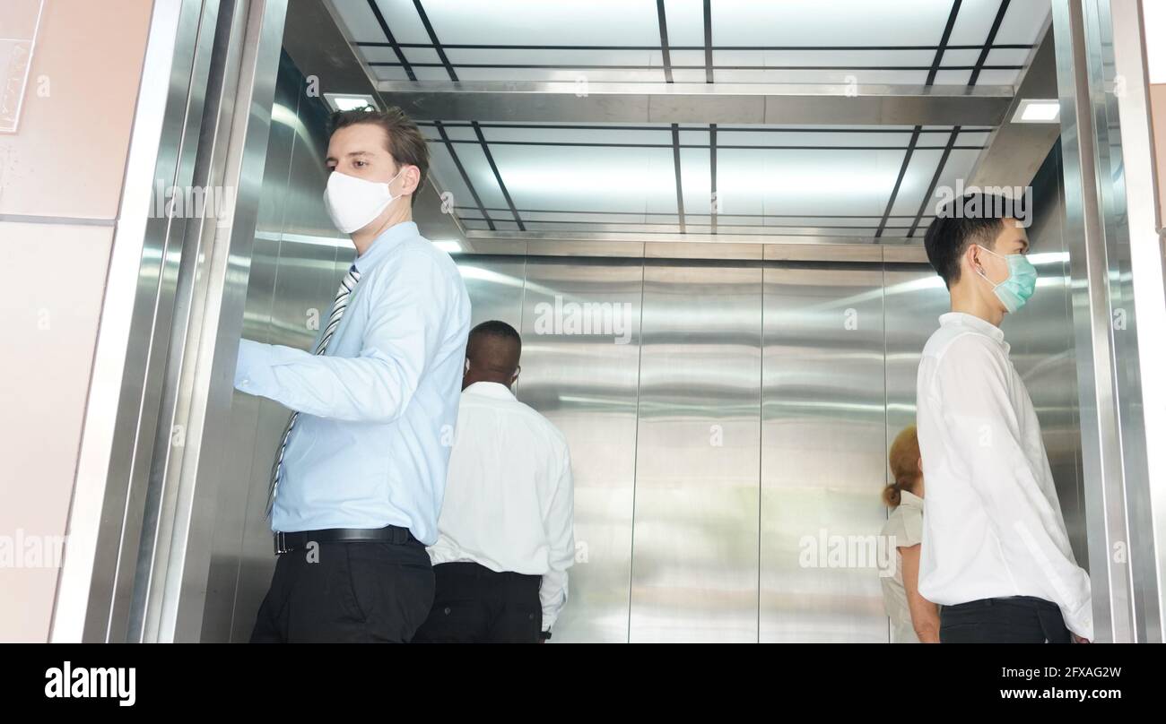 Social distancing in elevators coronavirus outbreak people stay in ...