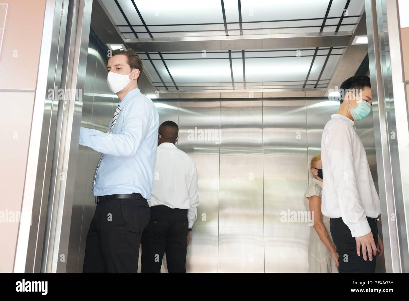 Social distancing in elevators coronavirus outbreak people stay in ...