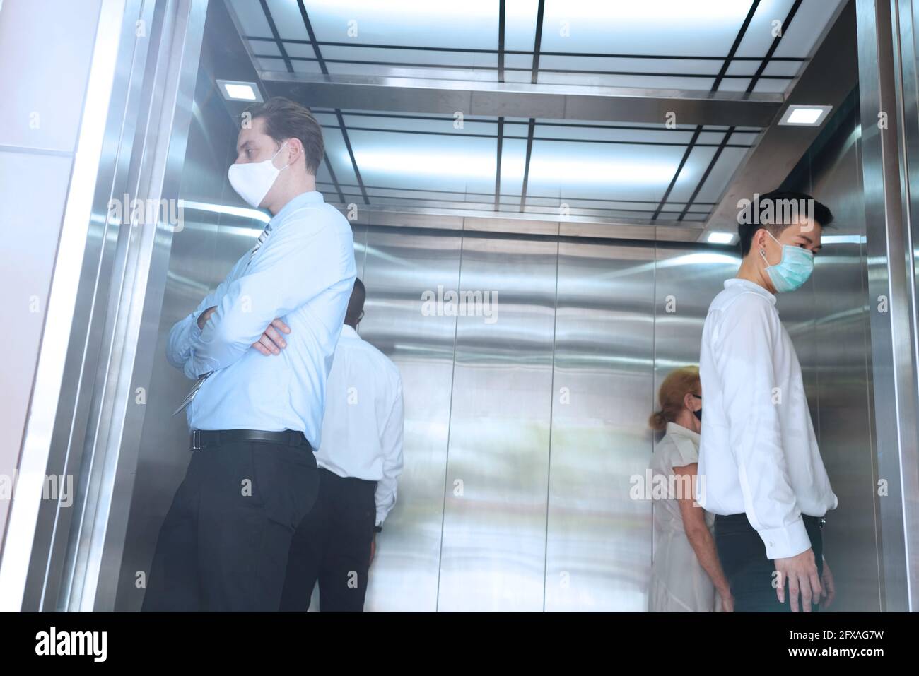 Social distancing in elevators coronavirus outbreak people stay in ...