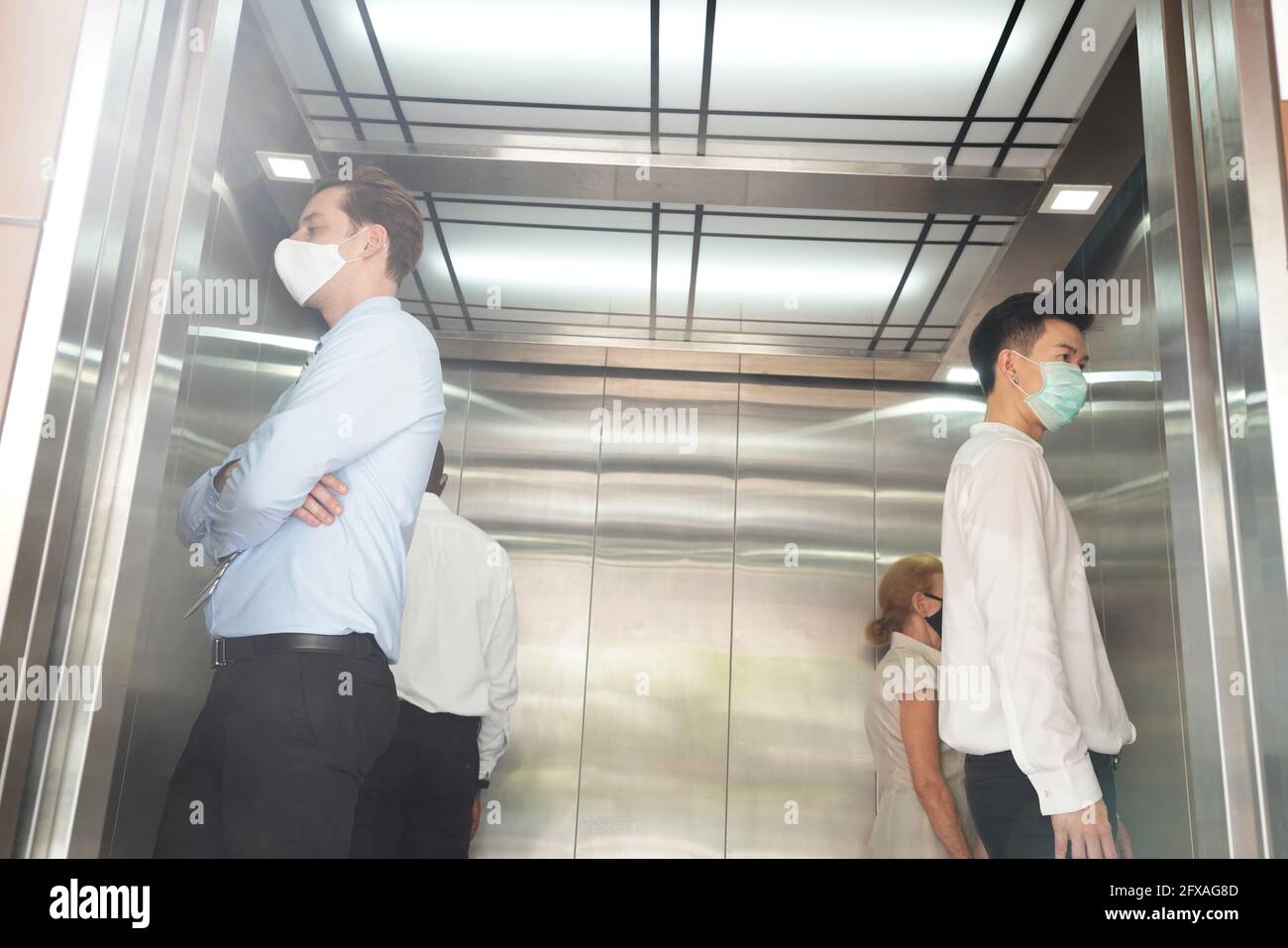 Social distancing in elevators coronavirus outbreak people stay in ...
