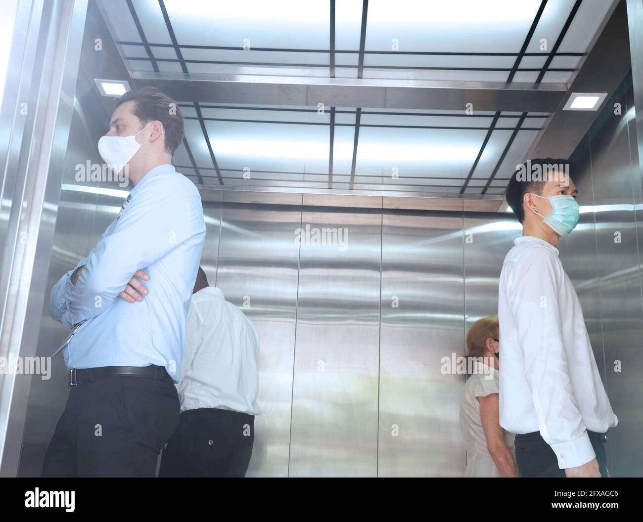 Social distancing in elevators coronavirus outbreak people stay in ...