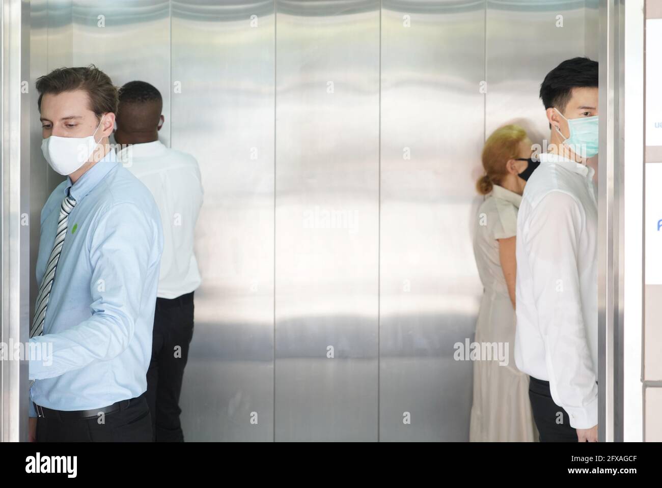 Social distancing in elevators coronavirus outbreak people stay in ...