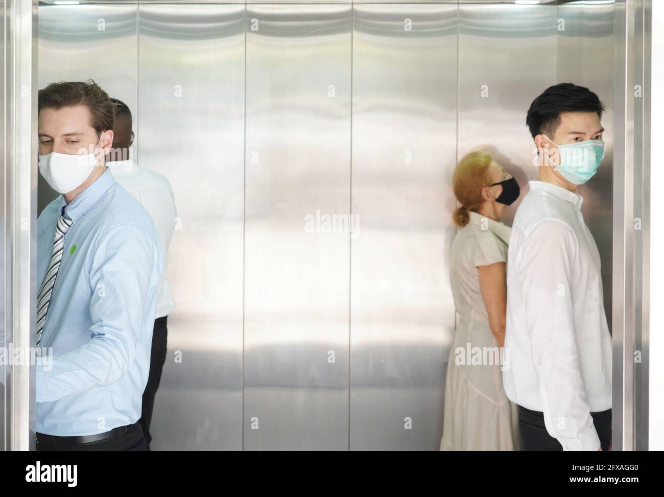 Social distancing in elevators coronavirus outbreak people stay in ...