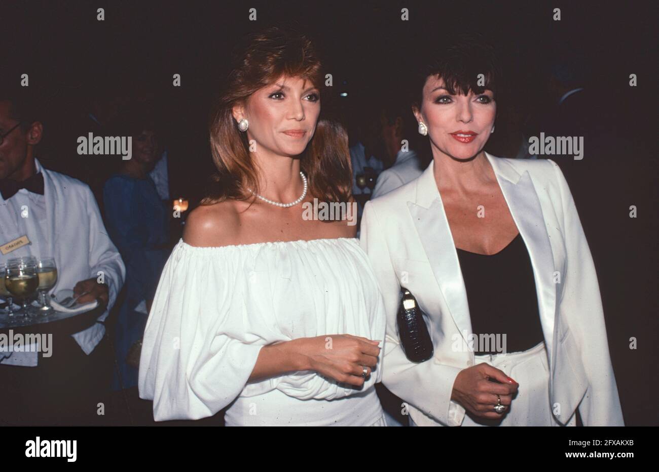 Los Angeles.CA.USA. LIBRARY. Victoria Principal and Joan Collins in the ...