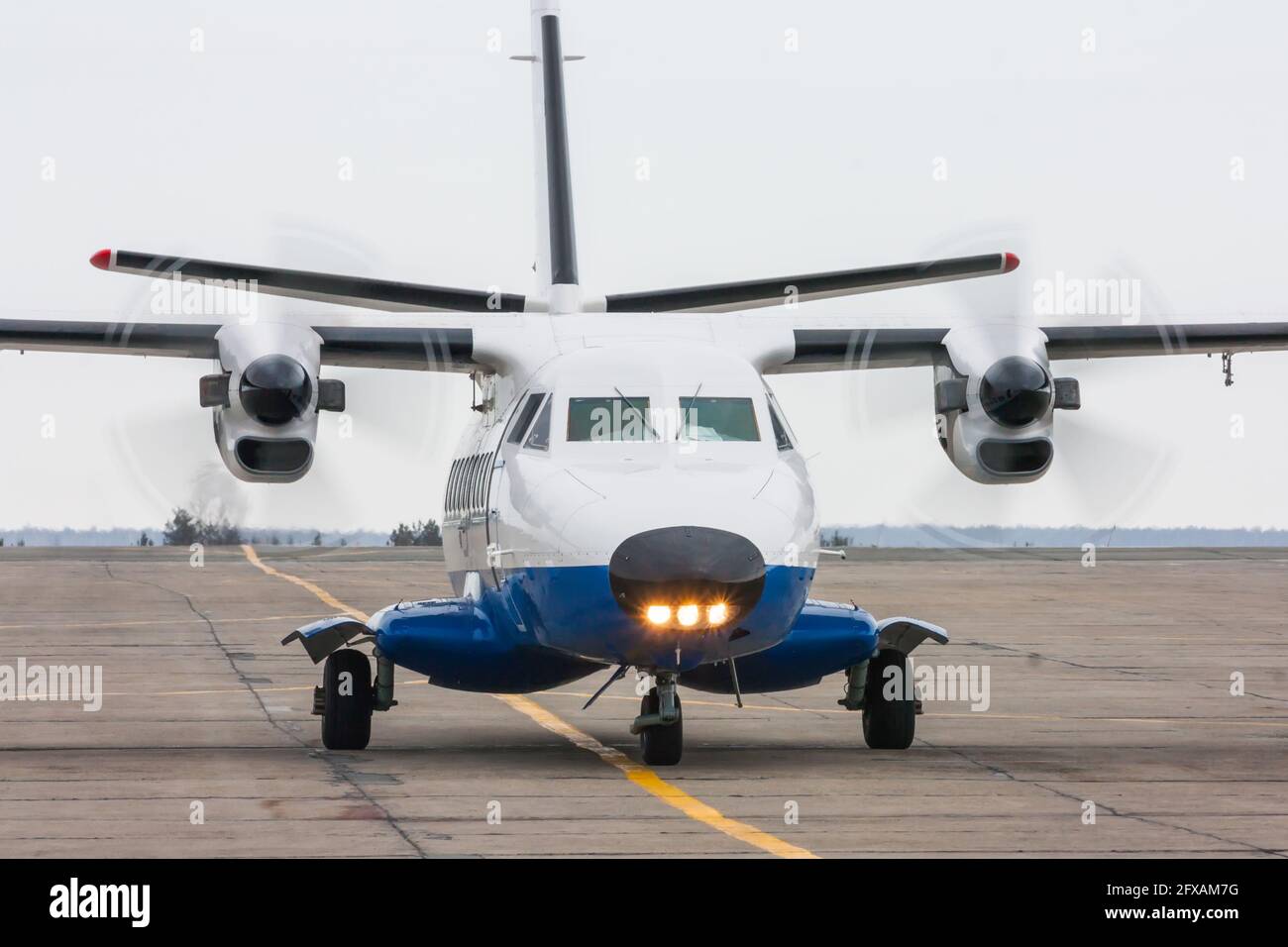 A small regional turboprop airplane at the airport apron Stock Photo ...