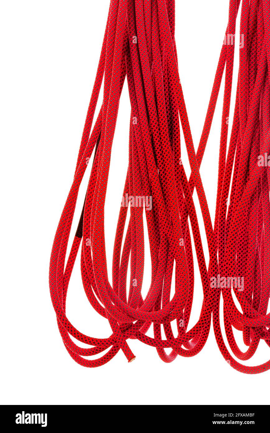 Red climbing rope against white background Stock Photo - Alamy
