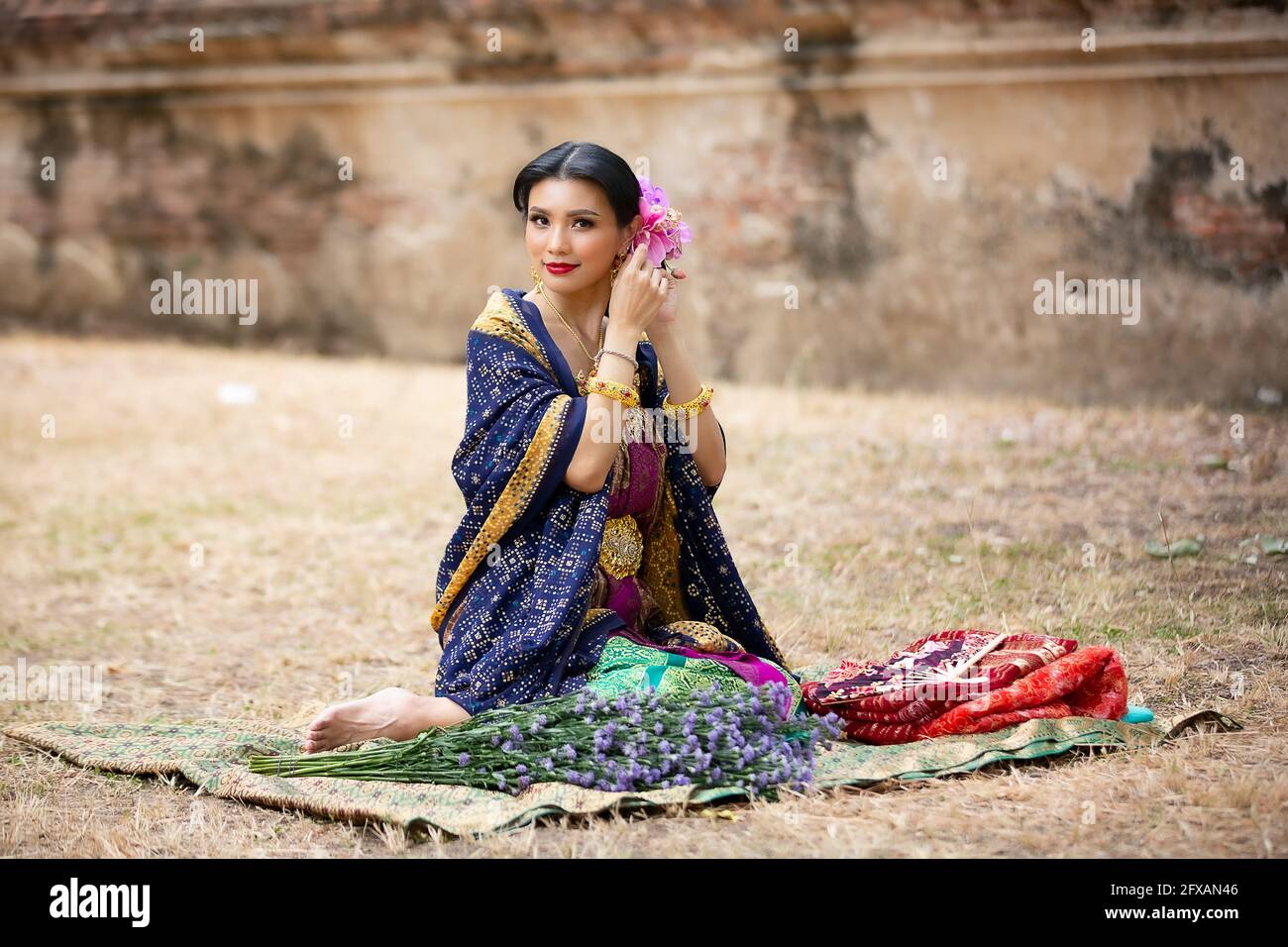 Asian travel background. Beautiful Balinese dancer woman in traditional ...