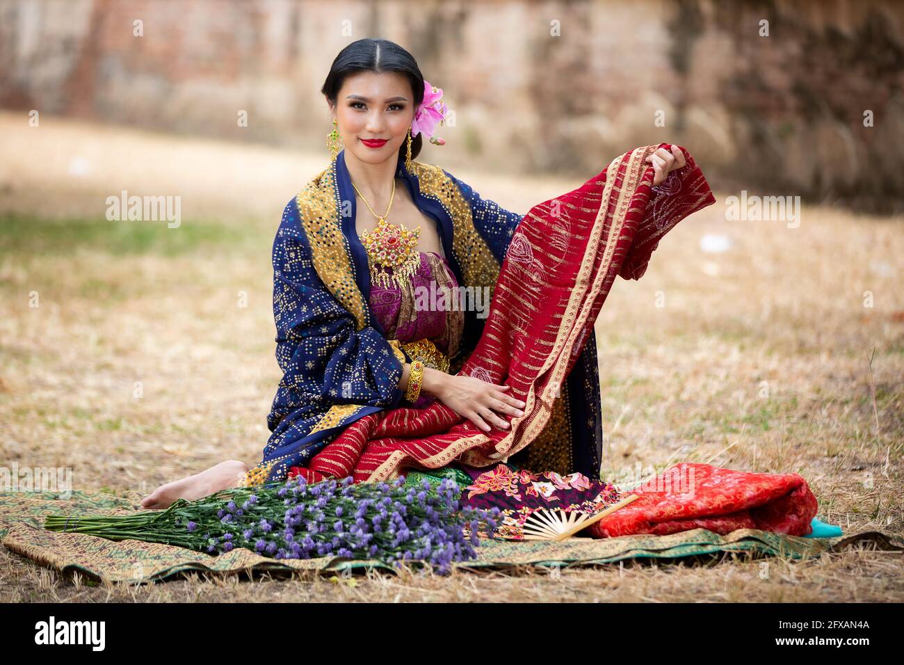 Asian travel background. Beautiful Balinese dancer woman in traditional ...