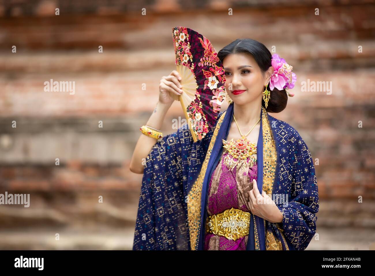 Asian travel background. Beautiful Balinese dancer woman in traditional ...