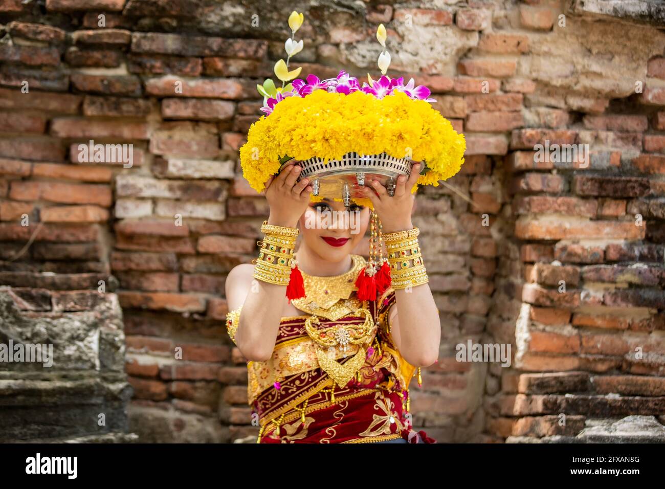 Asian travel background. Beautiful Balinese dancer woman in traditional ...