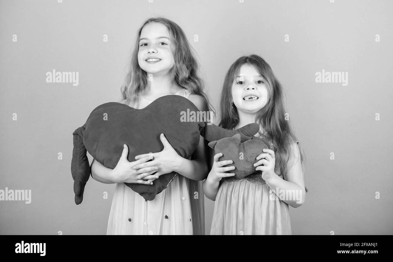 World heart day. Little girls holding big red hearts. Small children ...