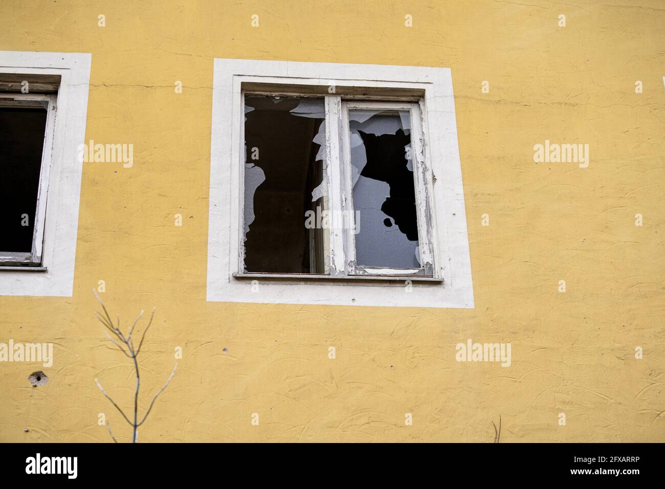Broken, smashed window glass on an uninhabited building in Bavaria ...