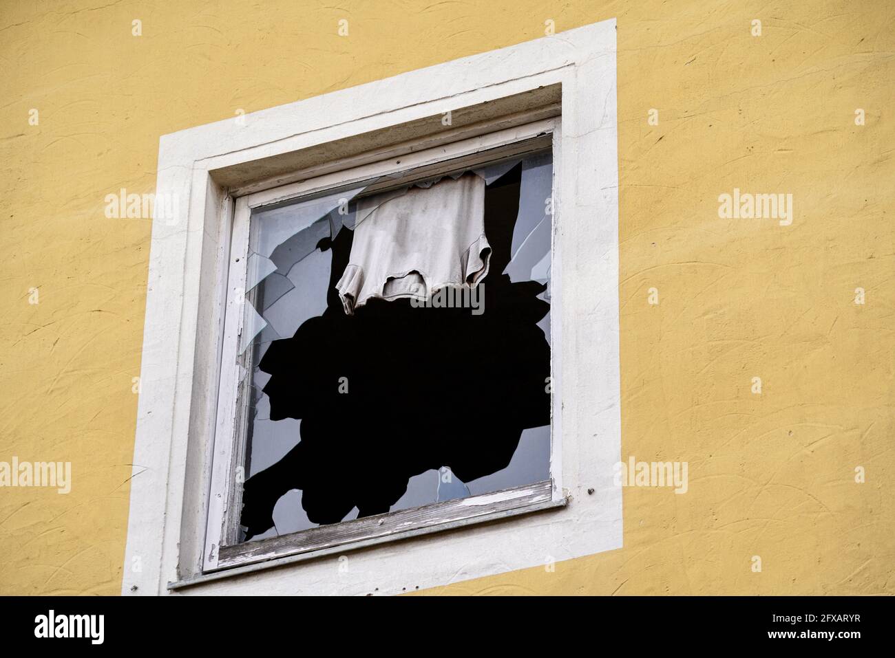 Broken, smashed window glass on an uninhabited building in Bavaria ...