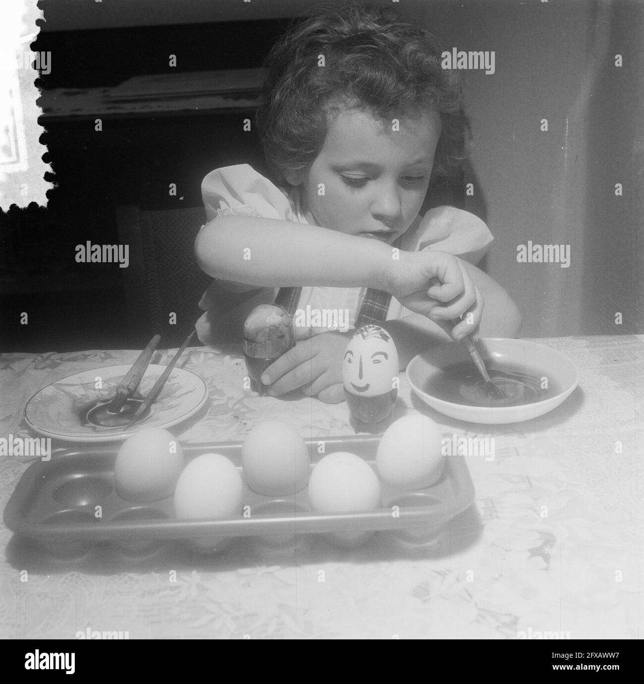 A girl paints an easter egg, April 6, 1957, eggs, girls, easter ...