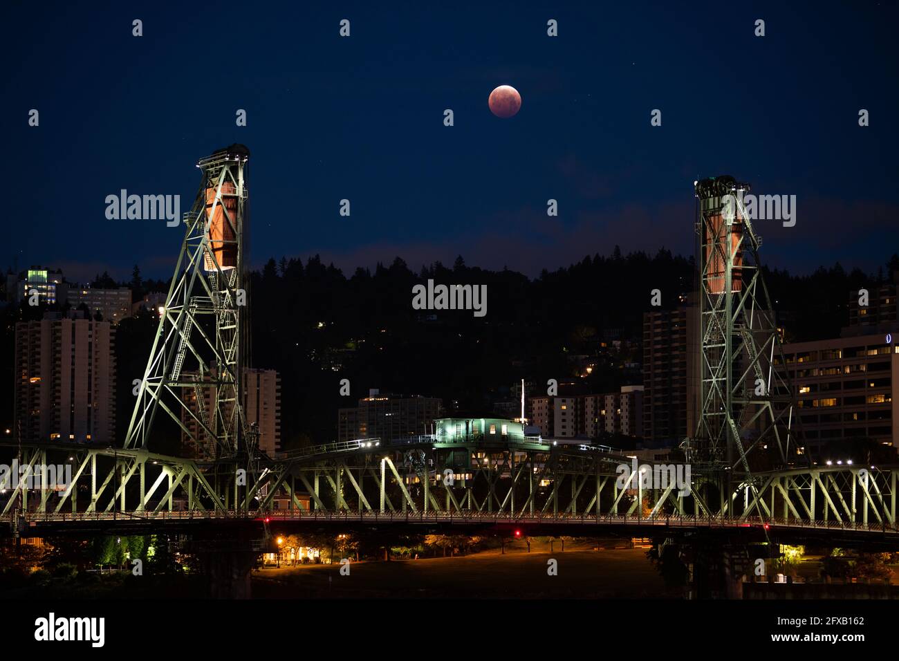 The eclipsed moon lies nestled between the trusses of the Hawthorne ...