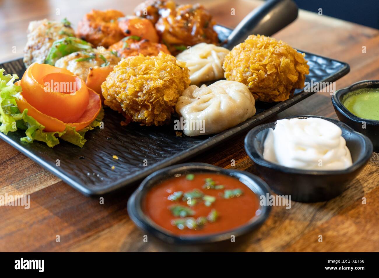 Fried momos hi-res stock photography and images - Alamy