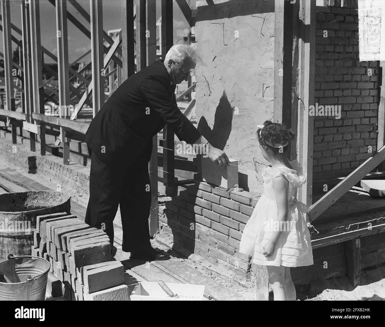First brick laid Black and White Stock Photos & Images - Alamy