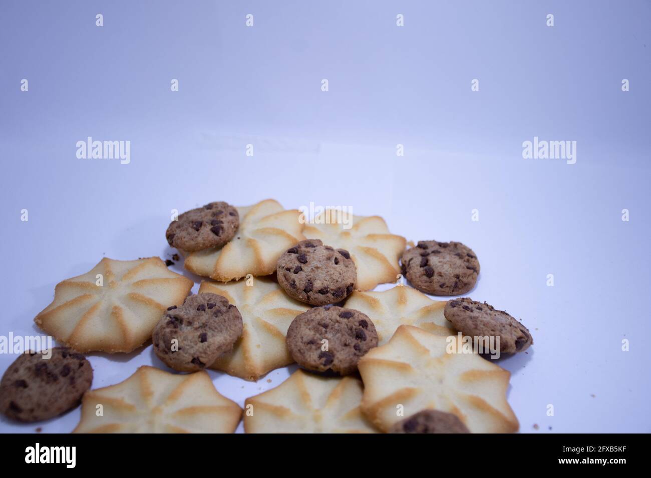 Delicious butter cookies and cholote chips, on a white background Stock ...