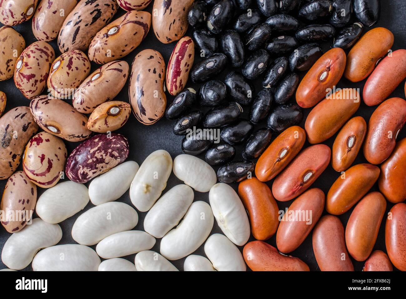 Different types of beans mixed background Stock Photo - Alamy