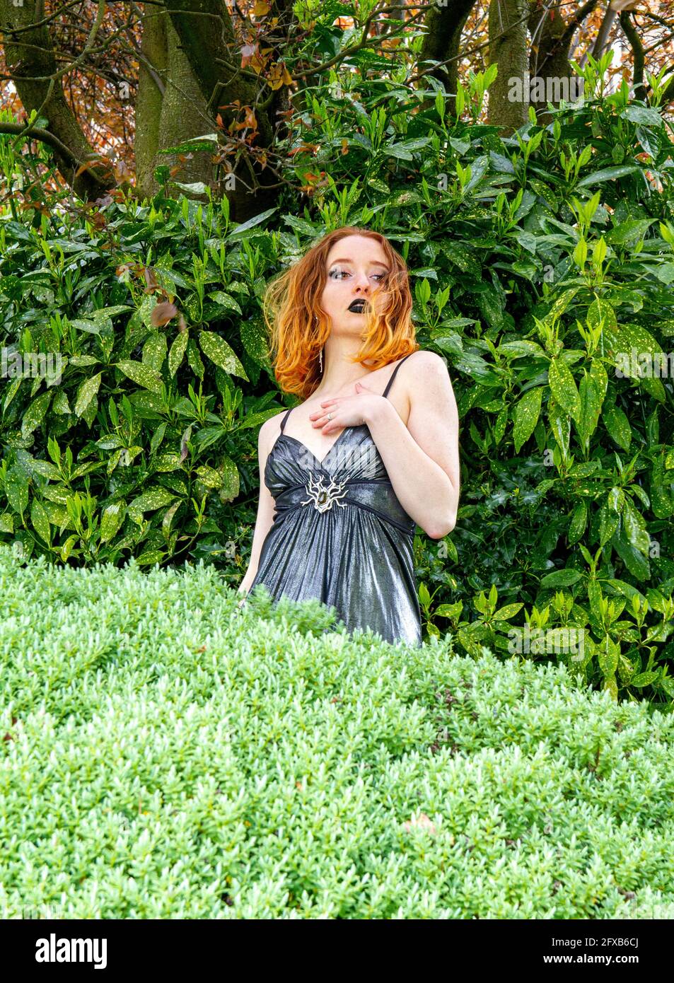 Fashionable Ashley Wilkinson is wearing a 1930`s style black evening ...