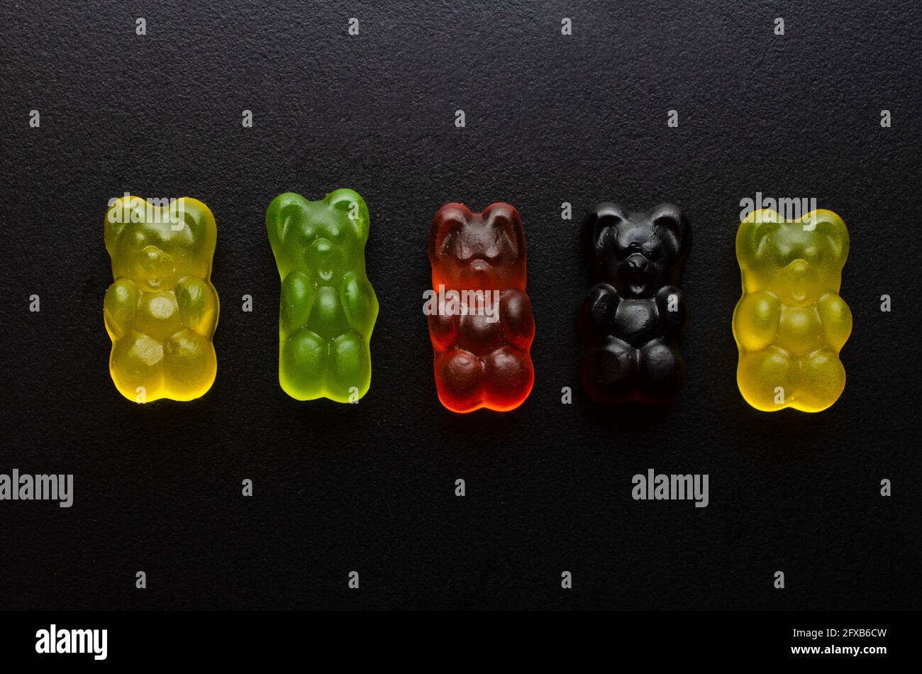 jelly bears on a black background Stock Photo - Alamy