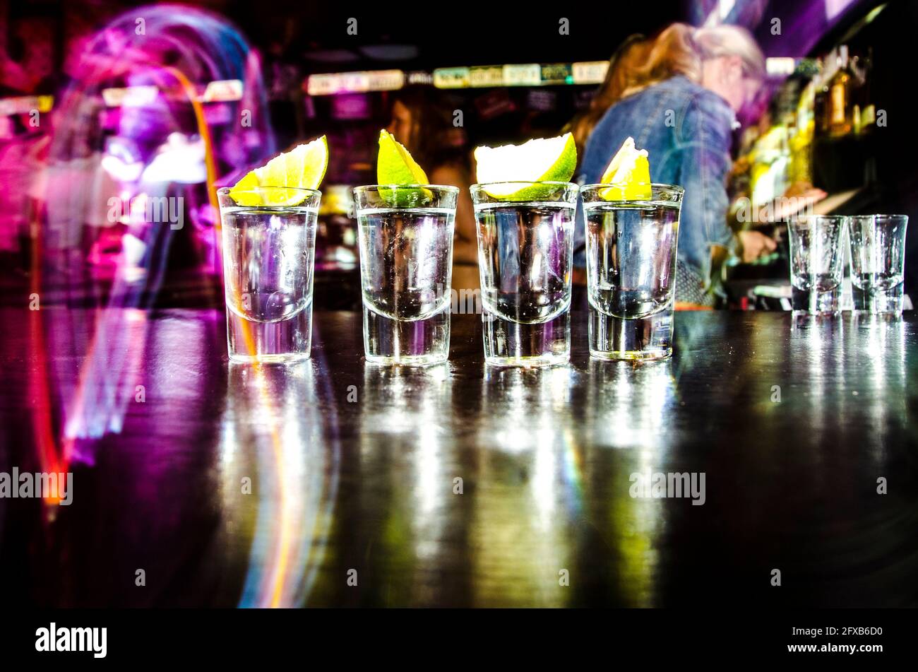 four glasses with Lim on the bar at a nightclub Stock Photo - Alamy