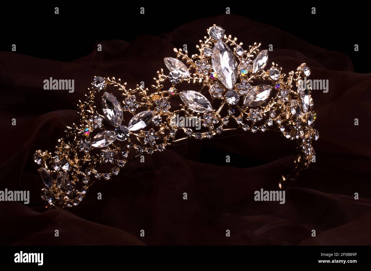 golden diadem with diamonds isolated on the fabric Stock Photo - Alamy