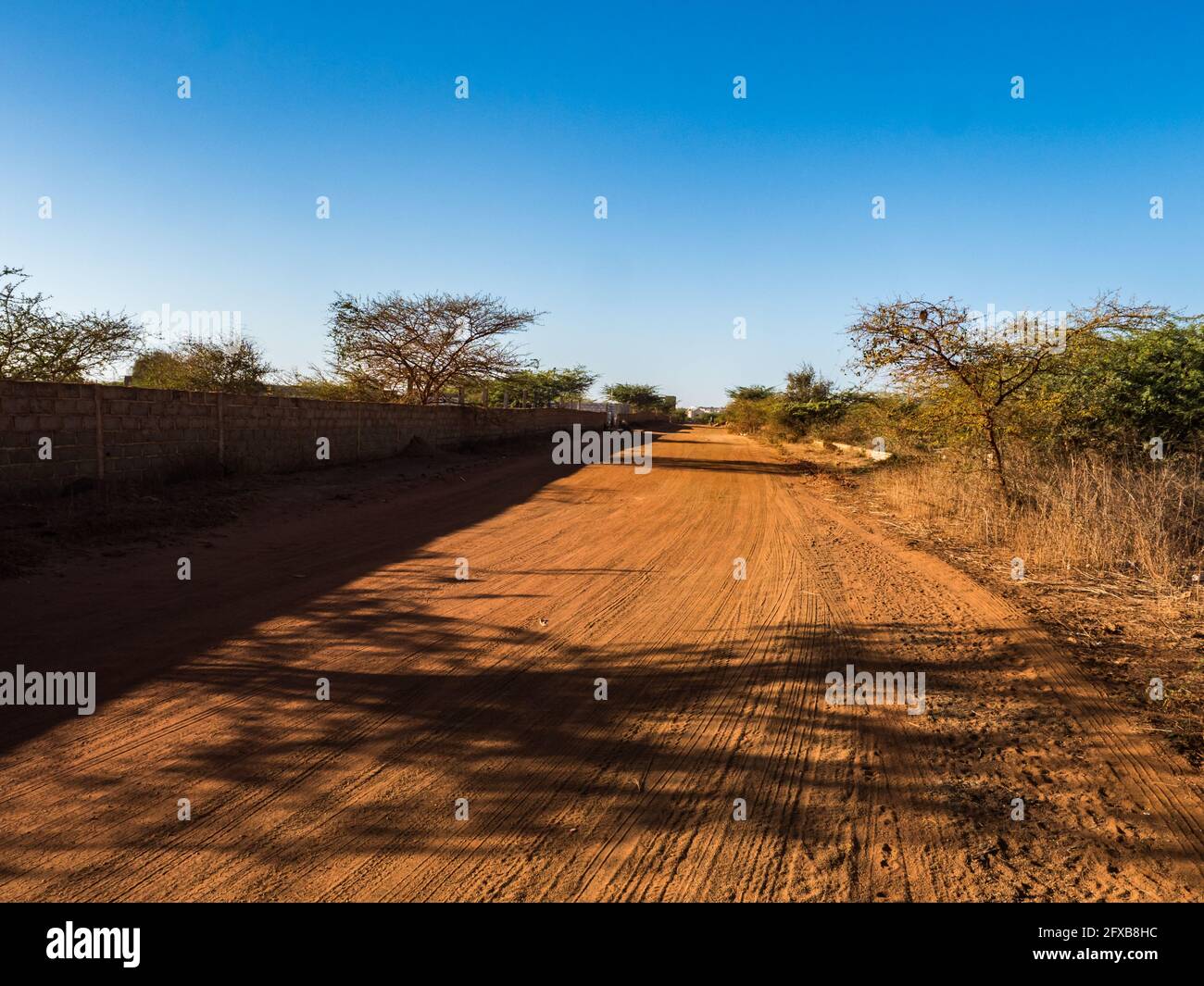 Africa's red dirt road. Senegal, Africa Stock Photo - Alamy