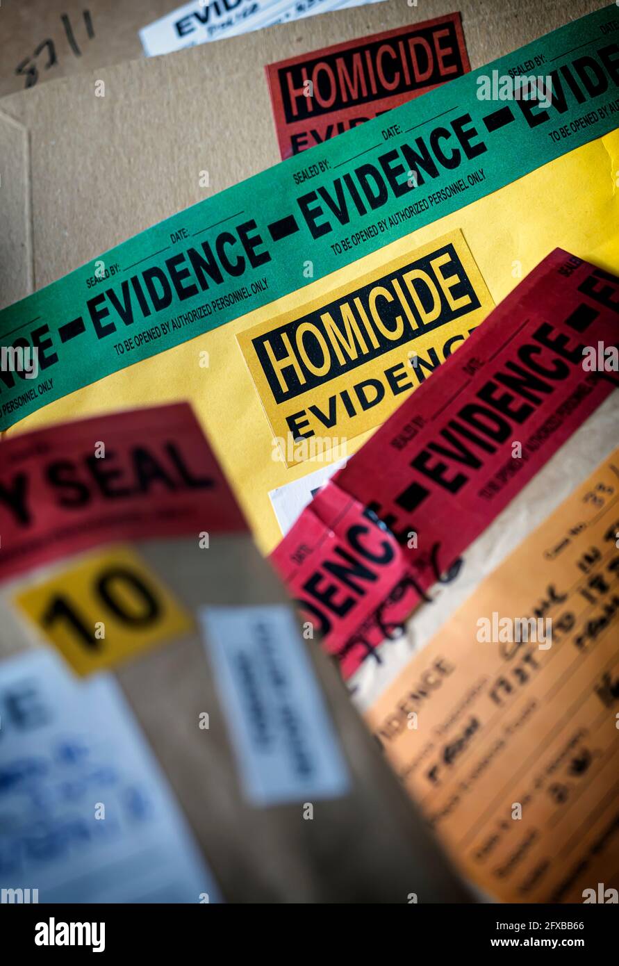 Files and evidence bag in a crime lab, conceptual image Stock Photo - Alamy