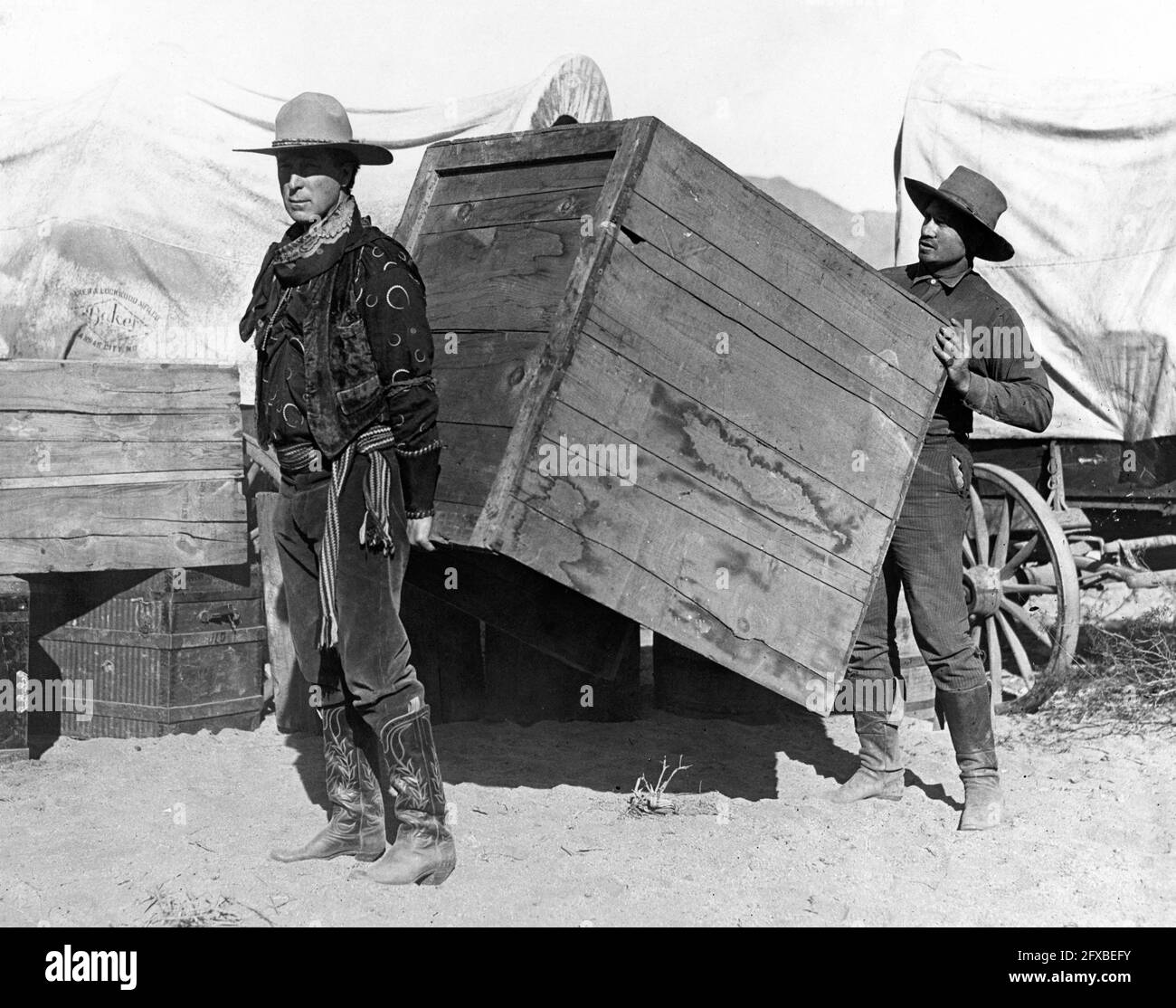 WILLIAM S. HART lends a hand on set location candid in the Mojave ...