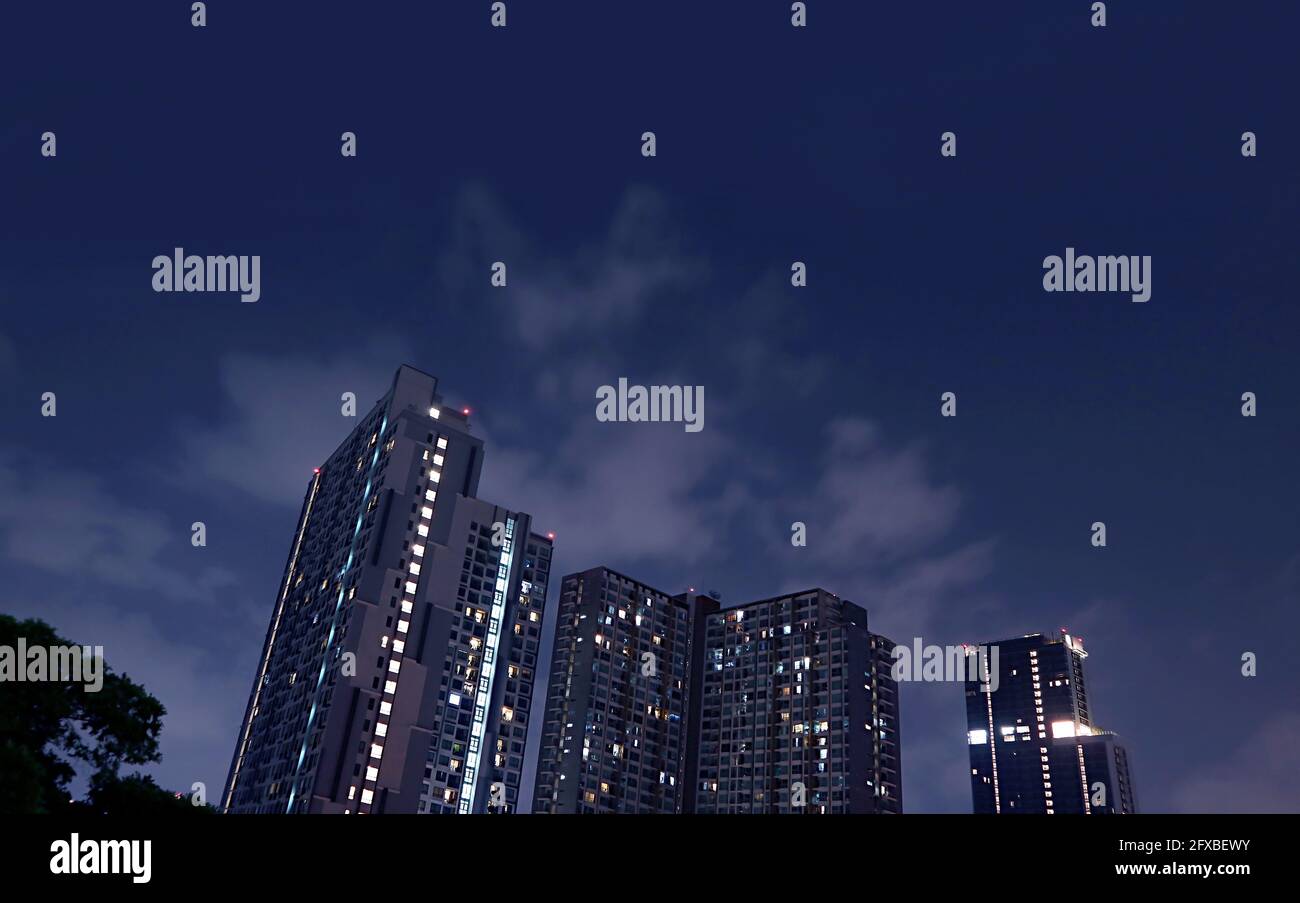 Skyscrapers at Night with Dark Blue Sky in the Backdrop Stock Photo - Alamy