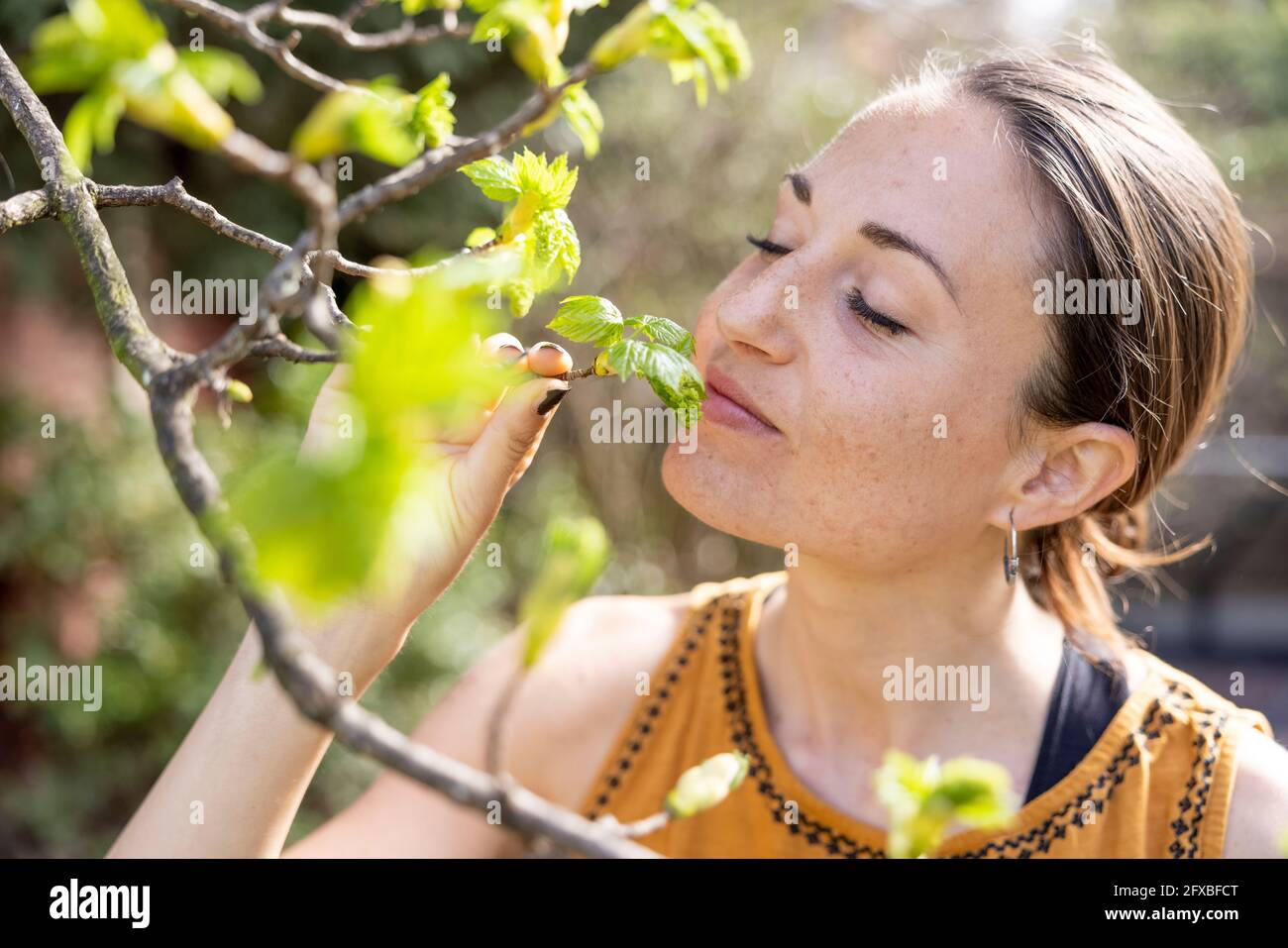 Mid adult woman eyes closed hi-res stock photography and images - Alamy