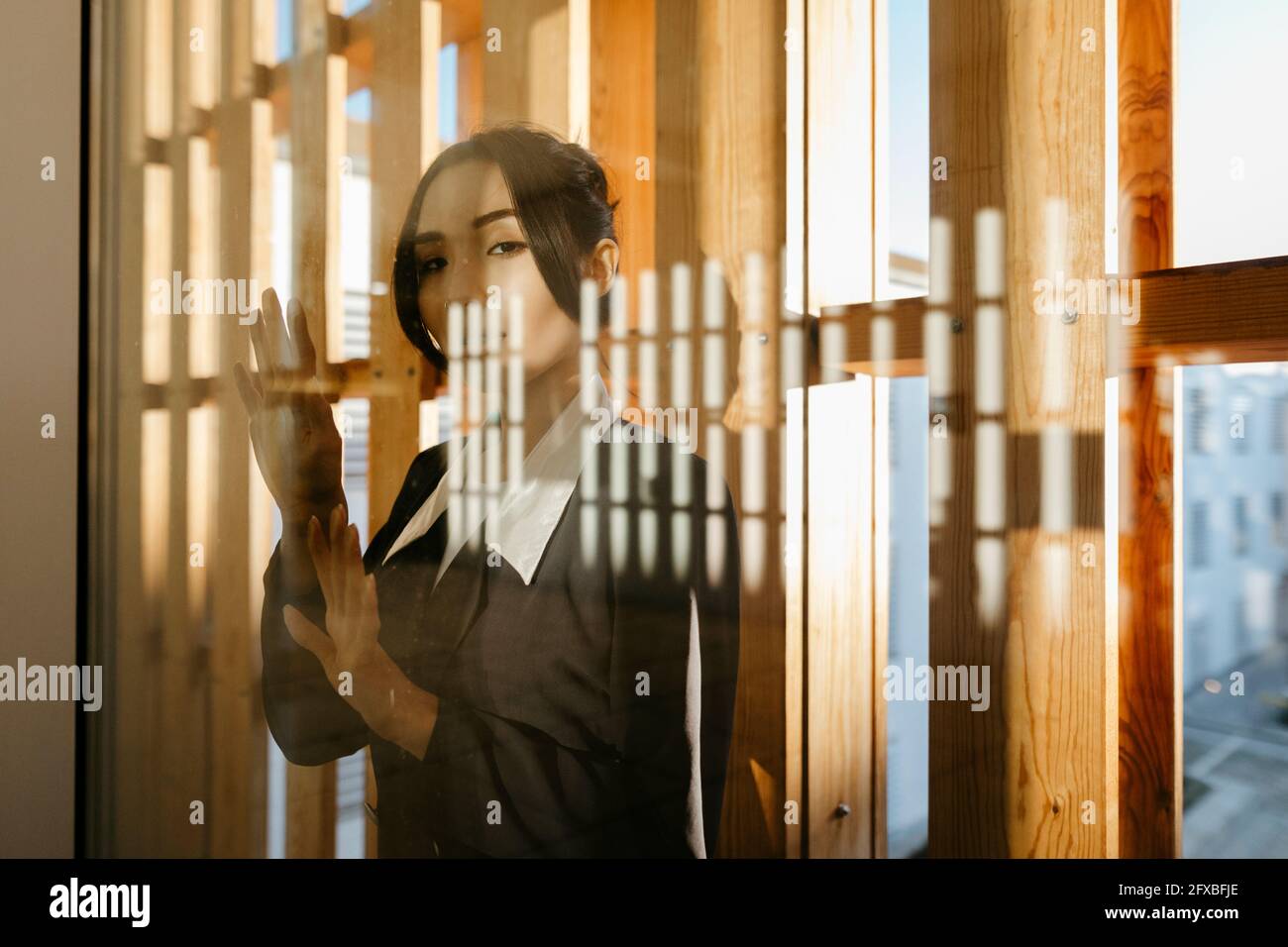 Young asian woman through window hi-res stock photography and images ...