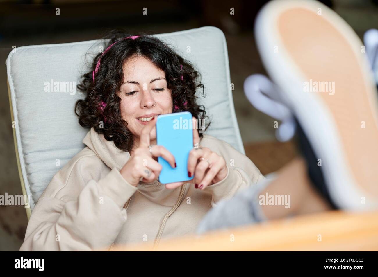 Woman with feet up hi-res stock photography and images - Alamy