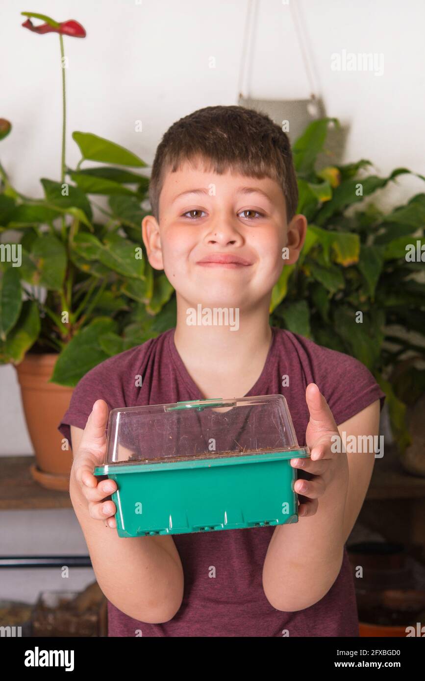 Boy holding box hi-res stock photography and images - Alamy