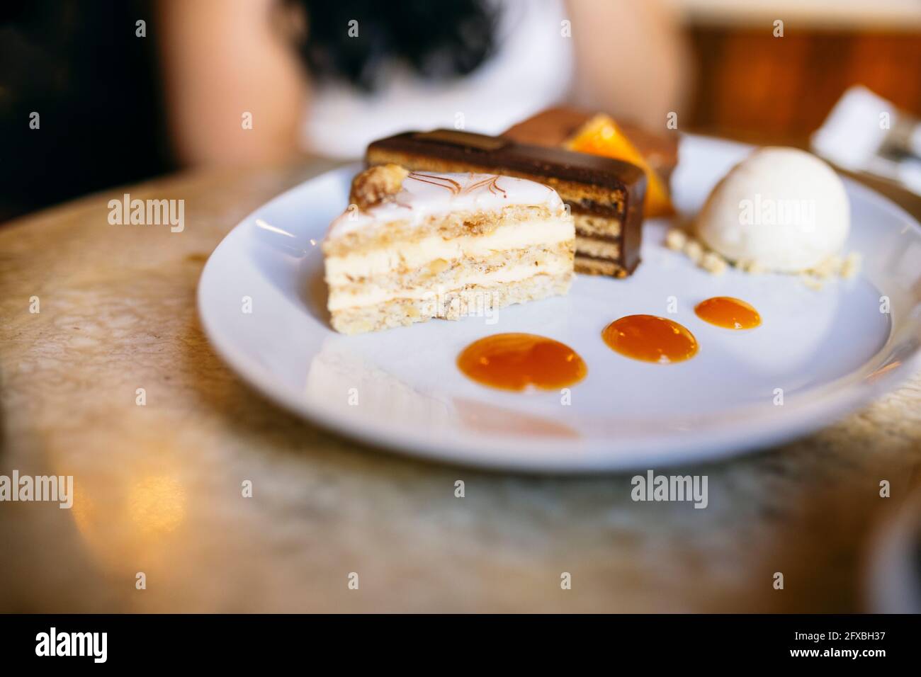 Cakes in plate at cafe Stock Photo - Alamy