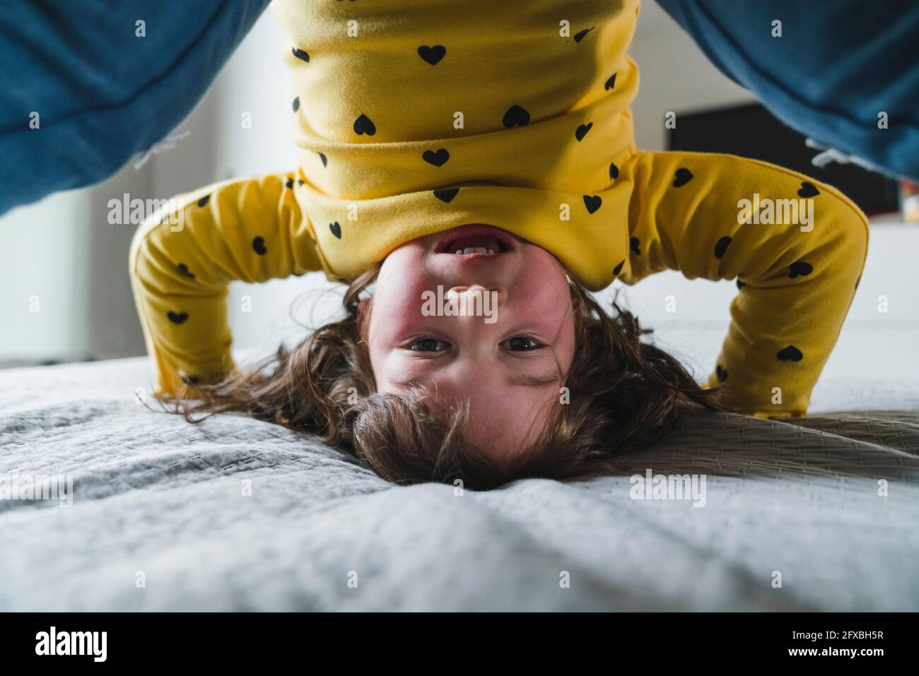 Child doing headstand hi-res stock photography and images - Alamy