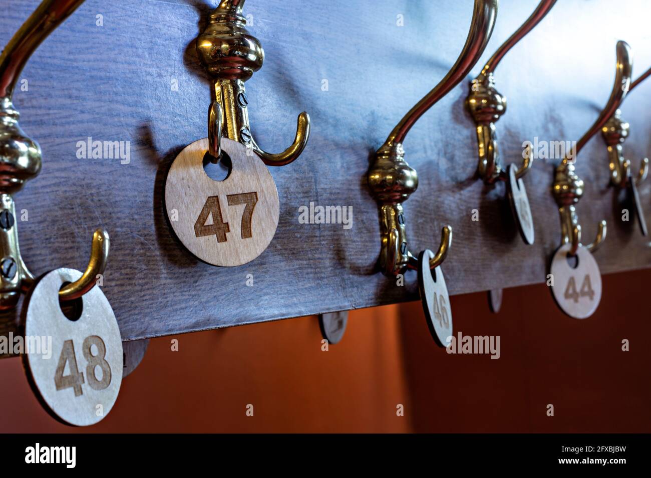Number labels hanging on hooks in stage theater cloakroom Stock Photo ...